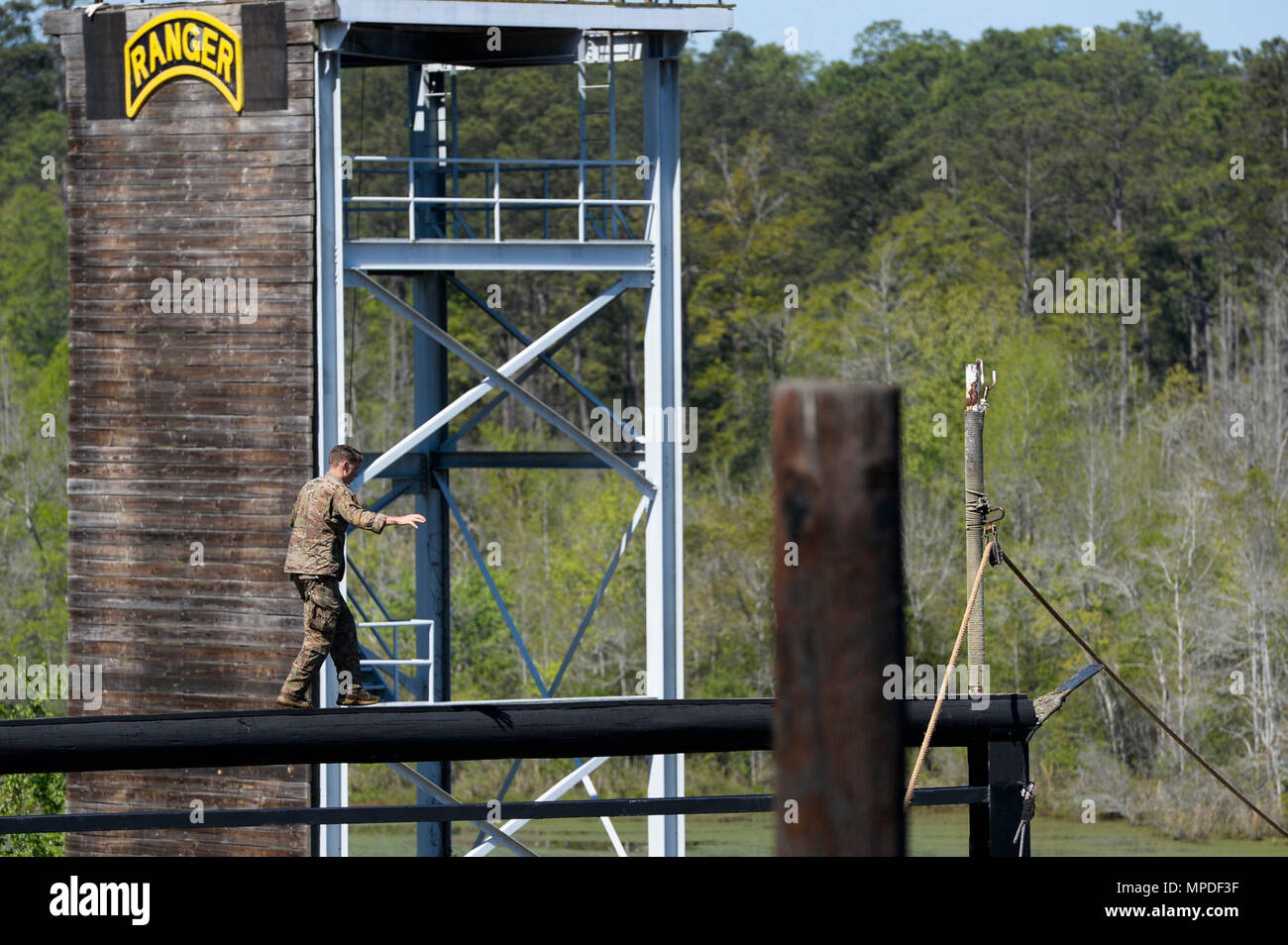 A U.S. Army Ranger crosses a balance beam over Victory Pond during the ...