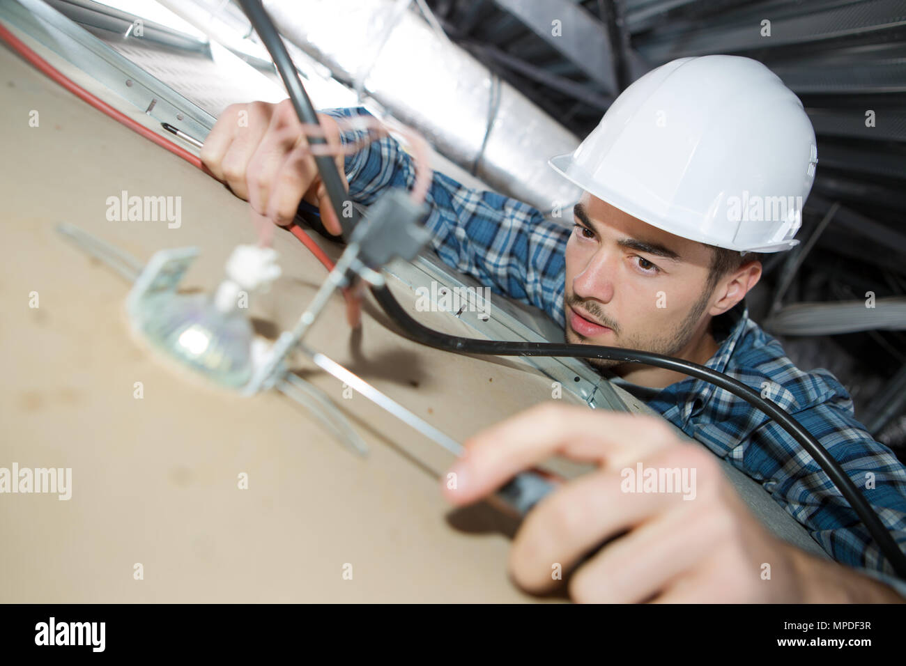 Electrician repair chandelier hi-res stock photography and images - Alamy
