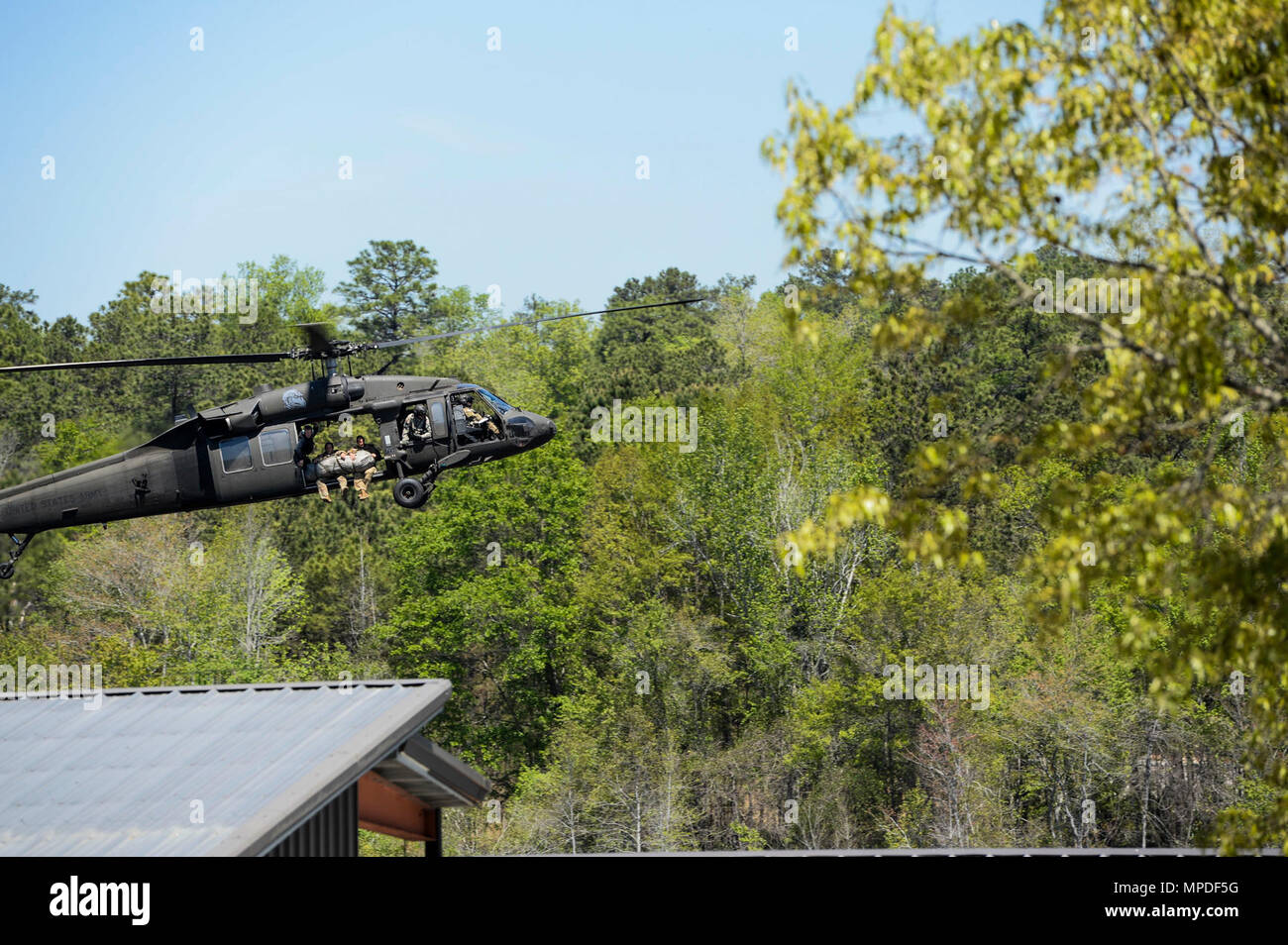 U.S. Army Rangers prepare to jump out of a UH-60 Black Hawk helicopter ...