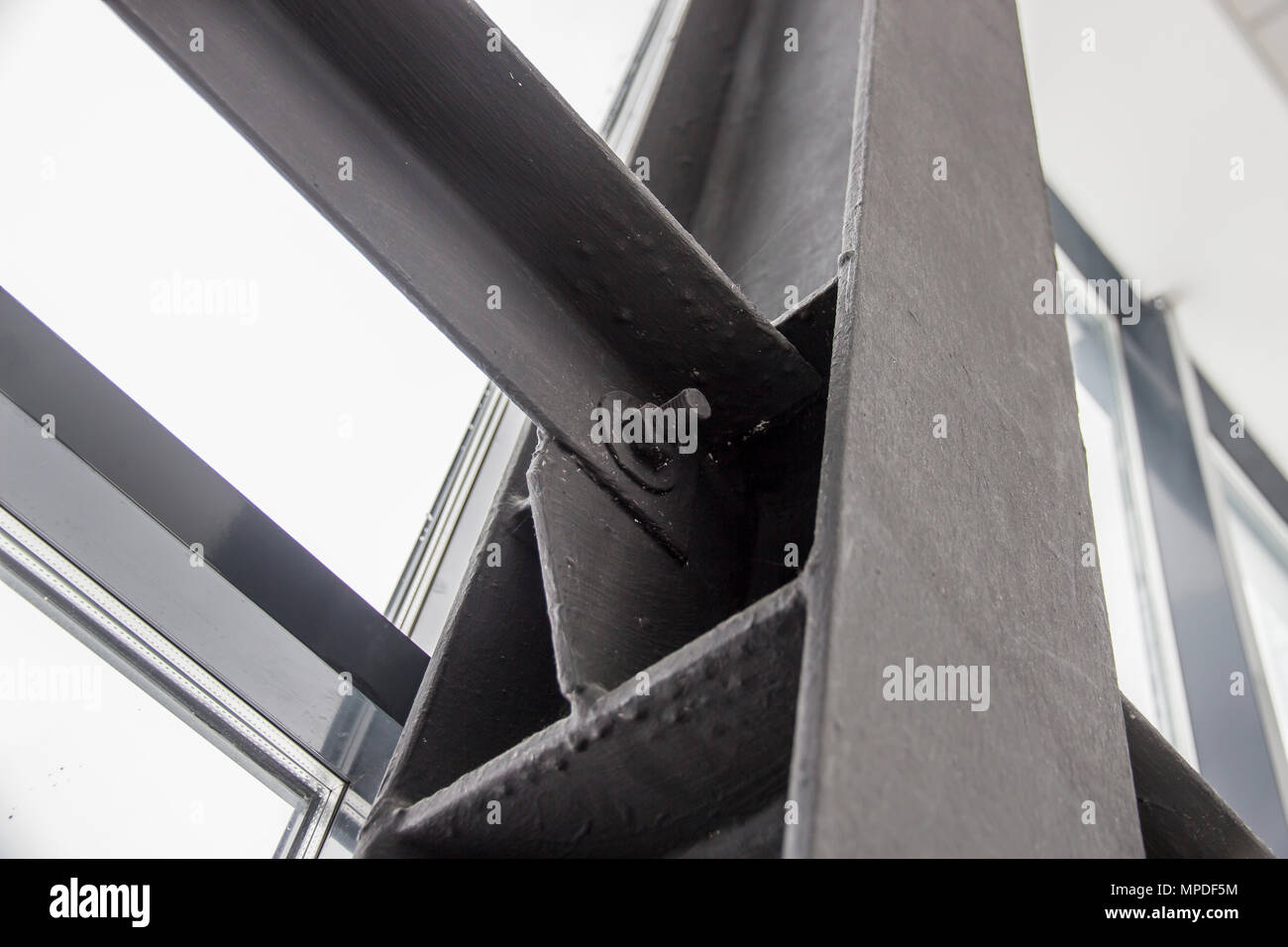Between the building structure of black metal girders connection Stock ...