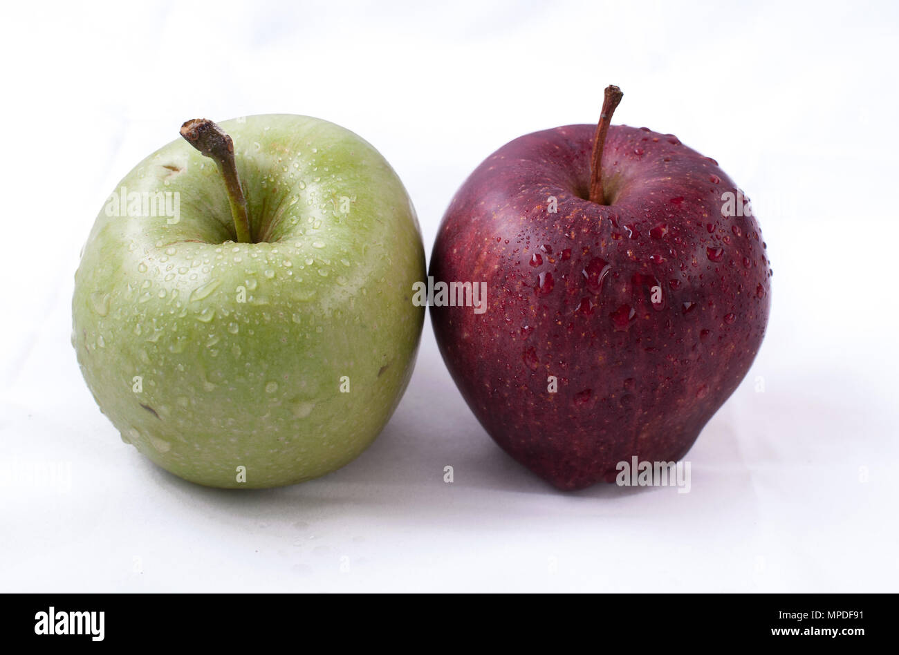 Green and red apples on a white background Stock Photo - Alamy