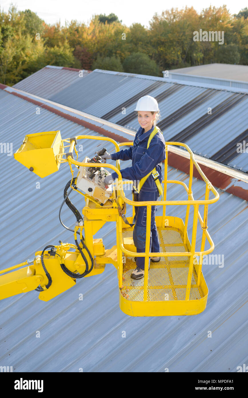 Woman in cherry picker cage hi-res stock photography and images - Alamy