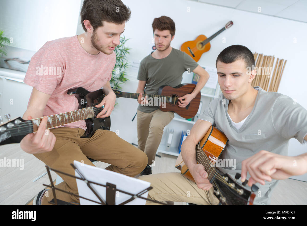 Professional musician playing singing home hi-res stock photography and ...