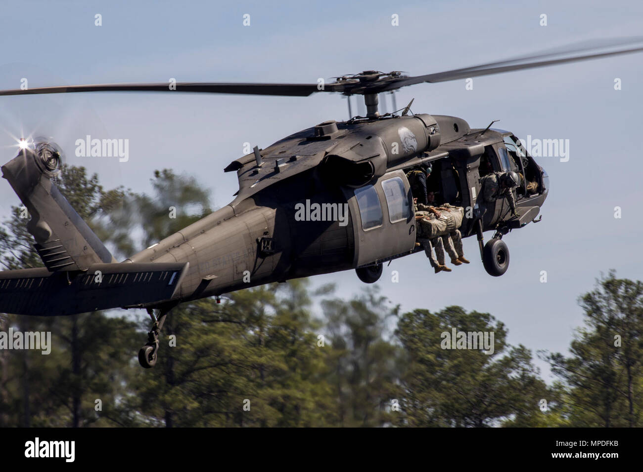 U.S. Army Rangers prepare to perform a helocast water insertion ...