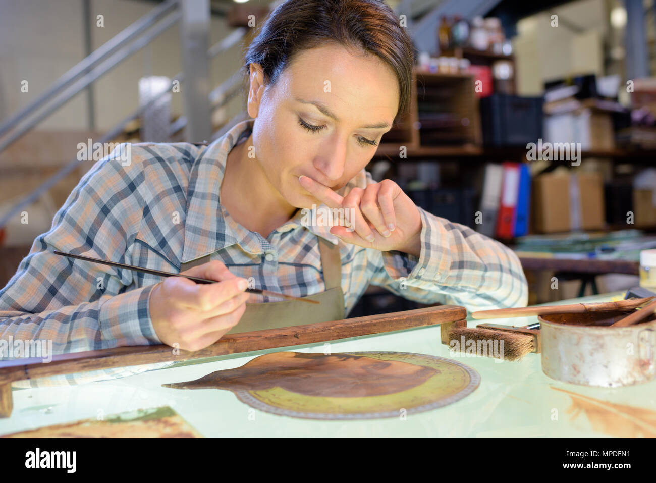 Artist contemplating her work Stock Photo - Alamy
