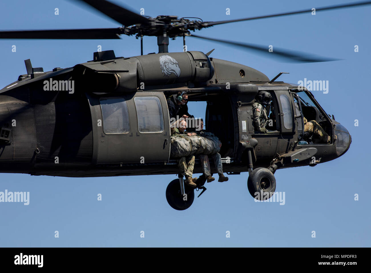 U.S. Army Rangers prepare to perform a helocast water insertion ...