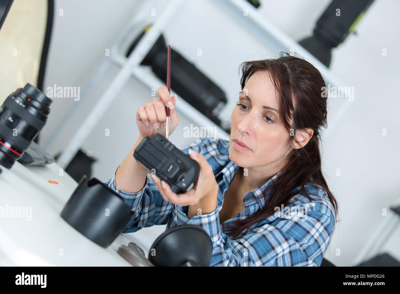 woman assembling the camera parts Stock Photo - Alamy