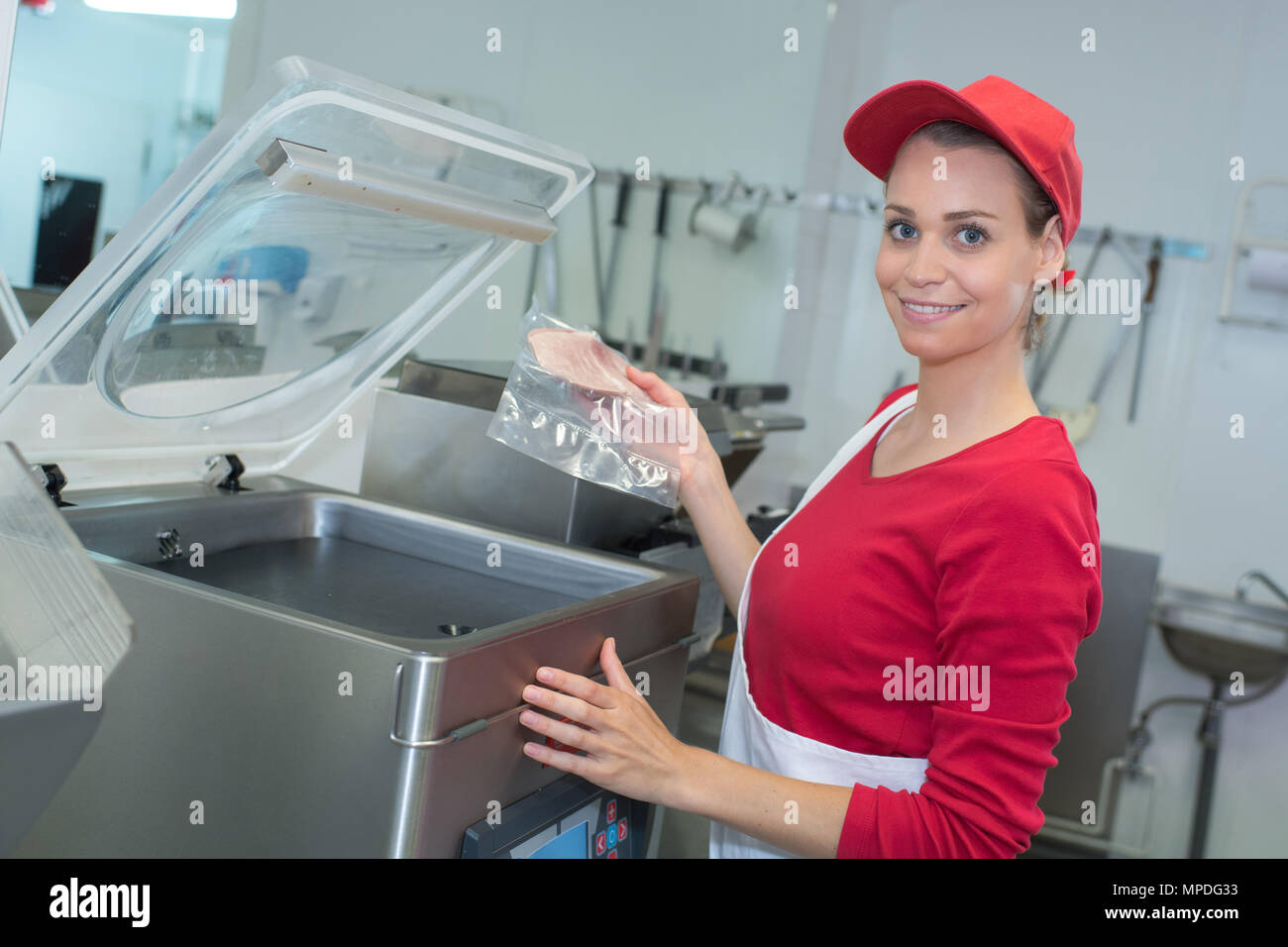 worker prepares meat butcher in meat industry Stock Photo - Alamy