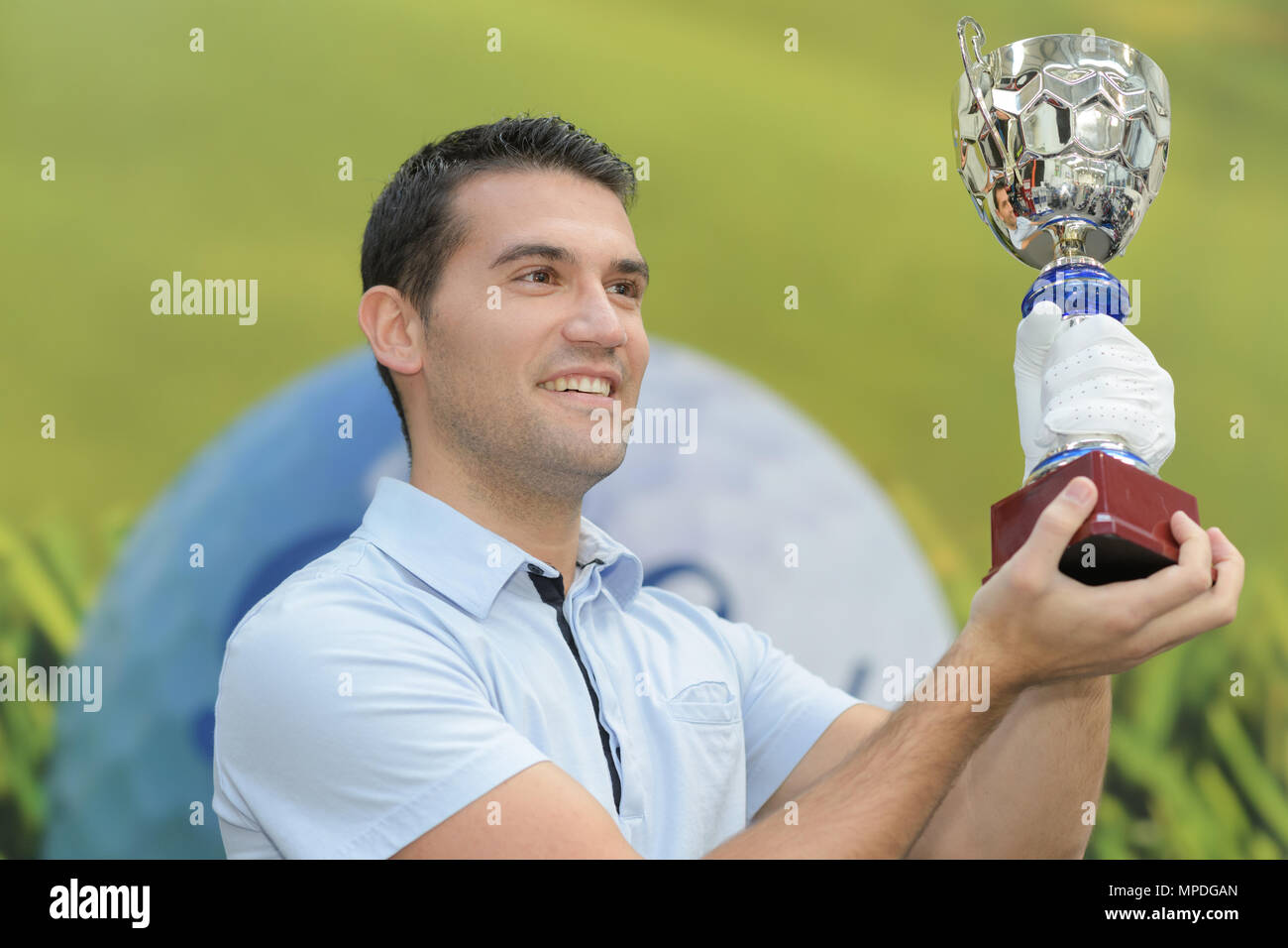 Glass award trophy holding hi-res stock photography and images - Alamy