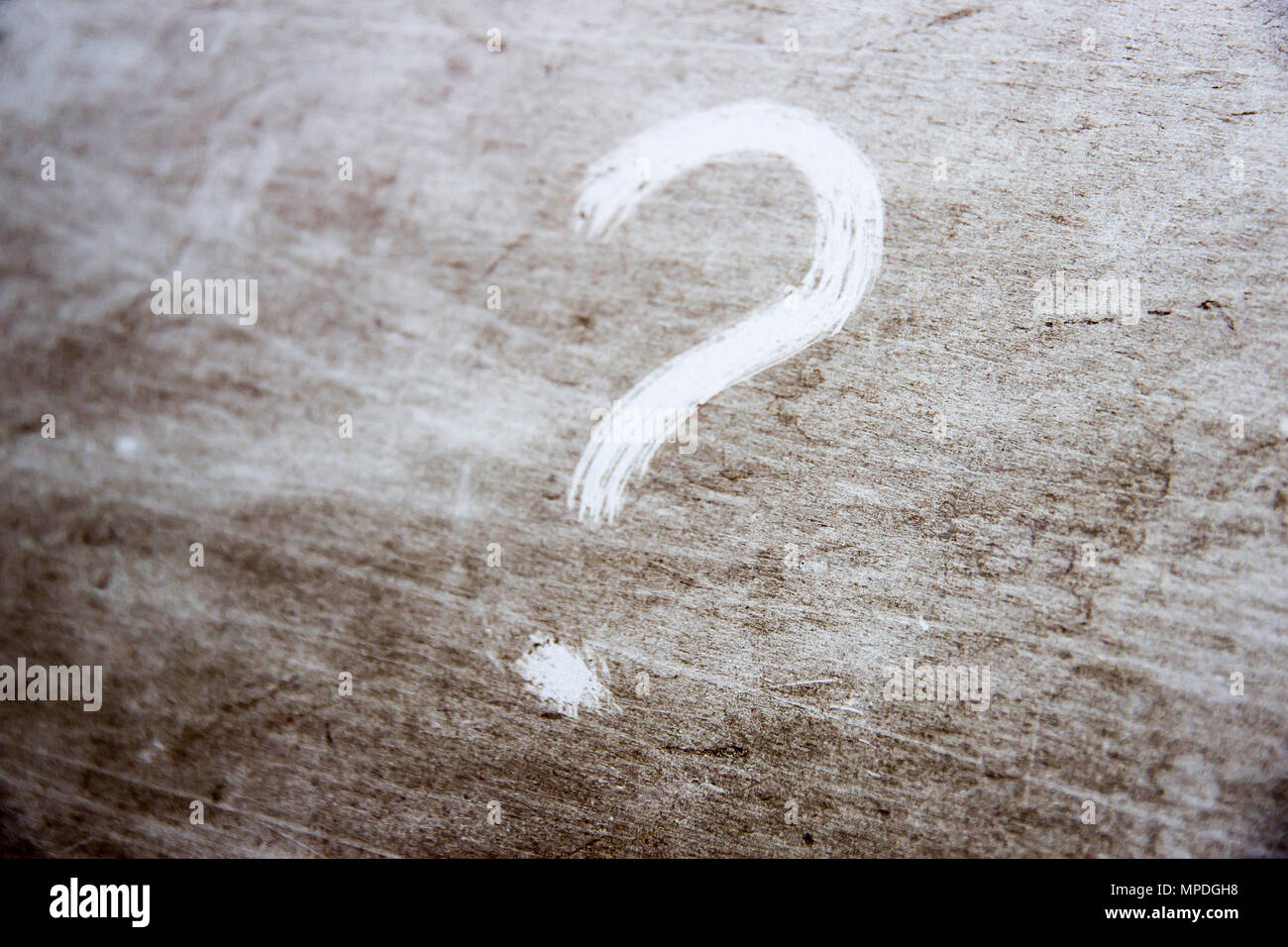 question mark is drawn on scratched dirty background Stock Photo - Alamy
