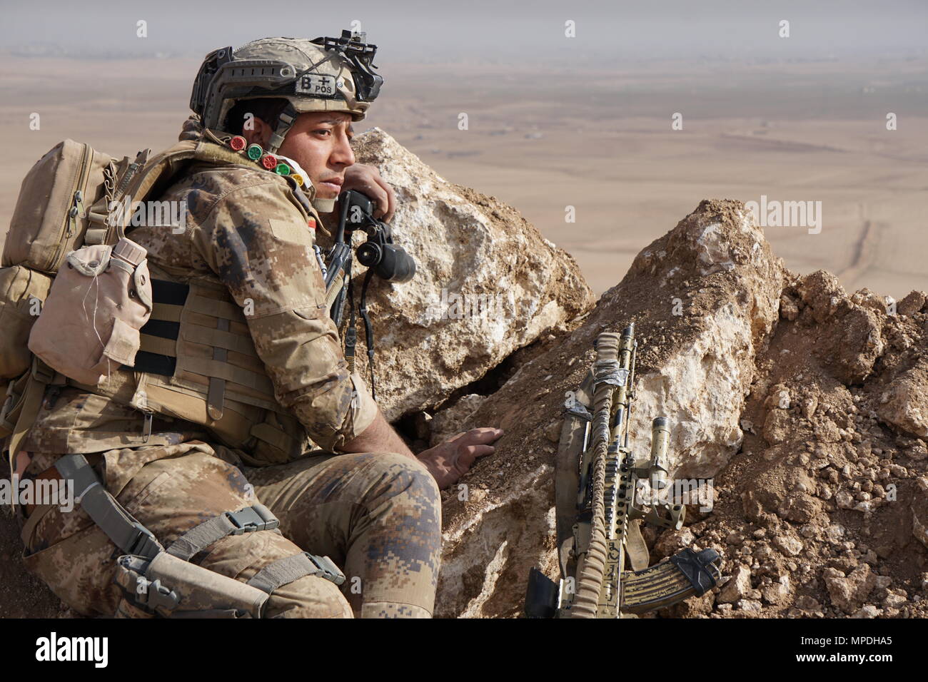 An Iraqi army soldier from 9th Iraqi Army Division sits at Al Asthana ...