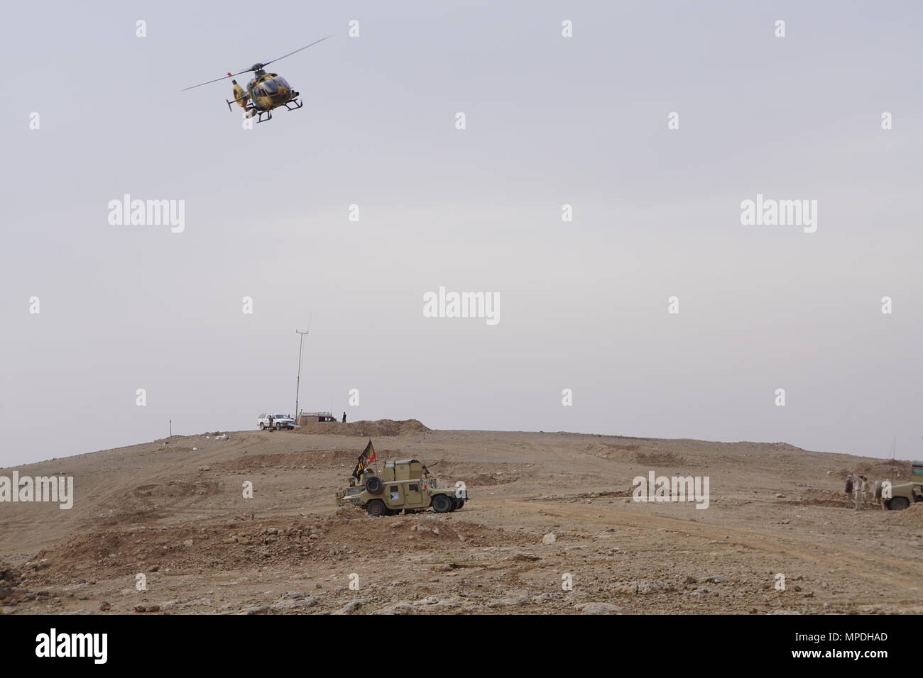 An Iraqi Army Aviation Bell 407 helicopter overflies a 9th Iraqi Army ...