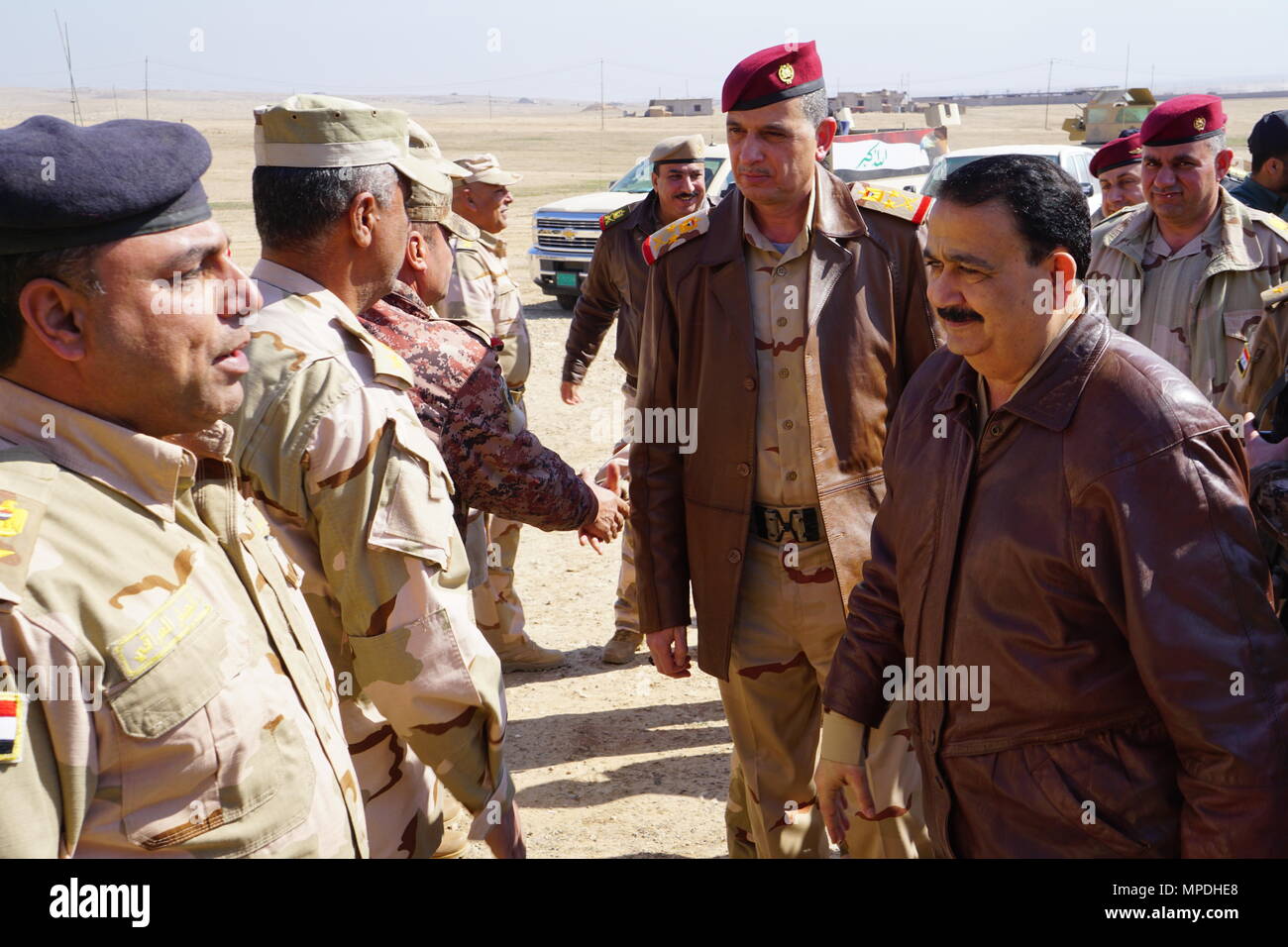 Brigade commanders and staff for the 9th Iraqi Army Division greet the ...