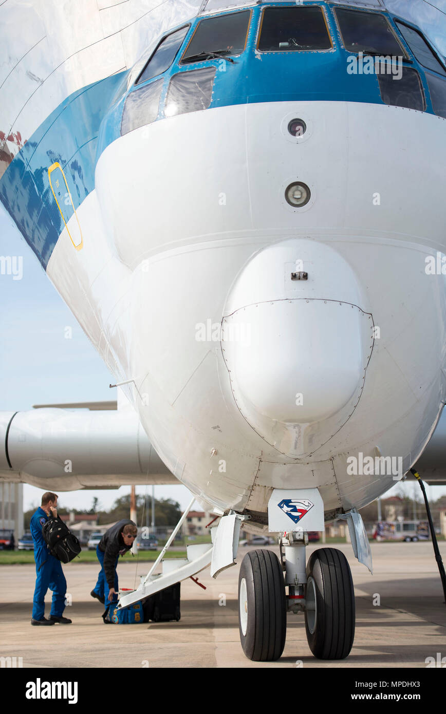 NASA pilots deboard the B-377 Super Guppy after arriving at Joint Base ...