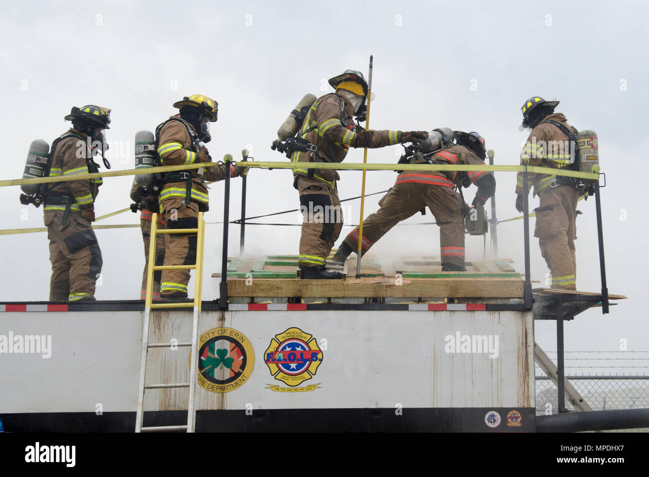 Firefighters perform vertical ventilation training at the second annual ...