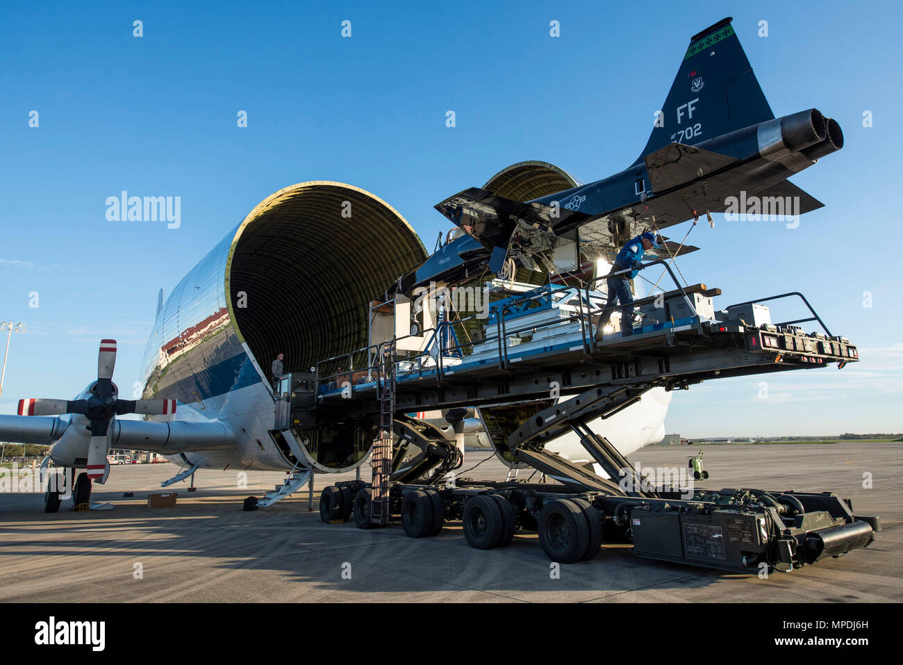 A T-38 Talon is unloaded from a B-377 Super Guppy March 3, 2017, at ...