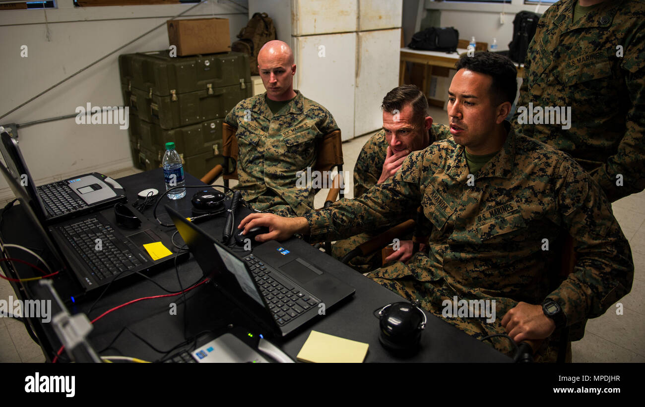 U.S. Marines assigned to Marine Air Support Squadron 6 listen in on ...