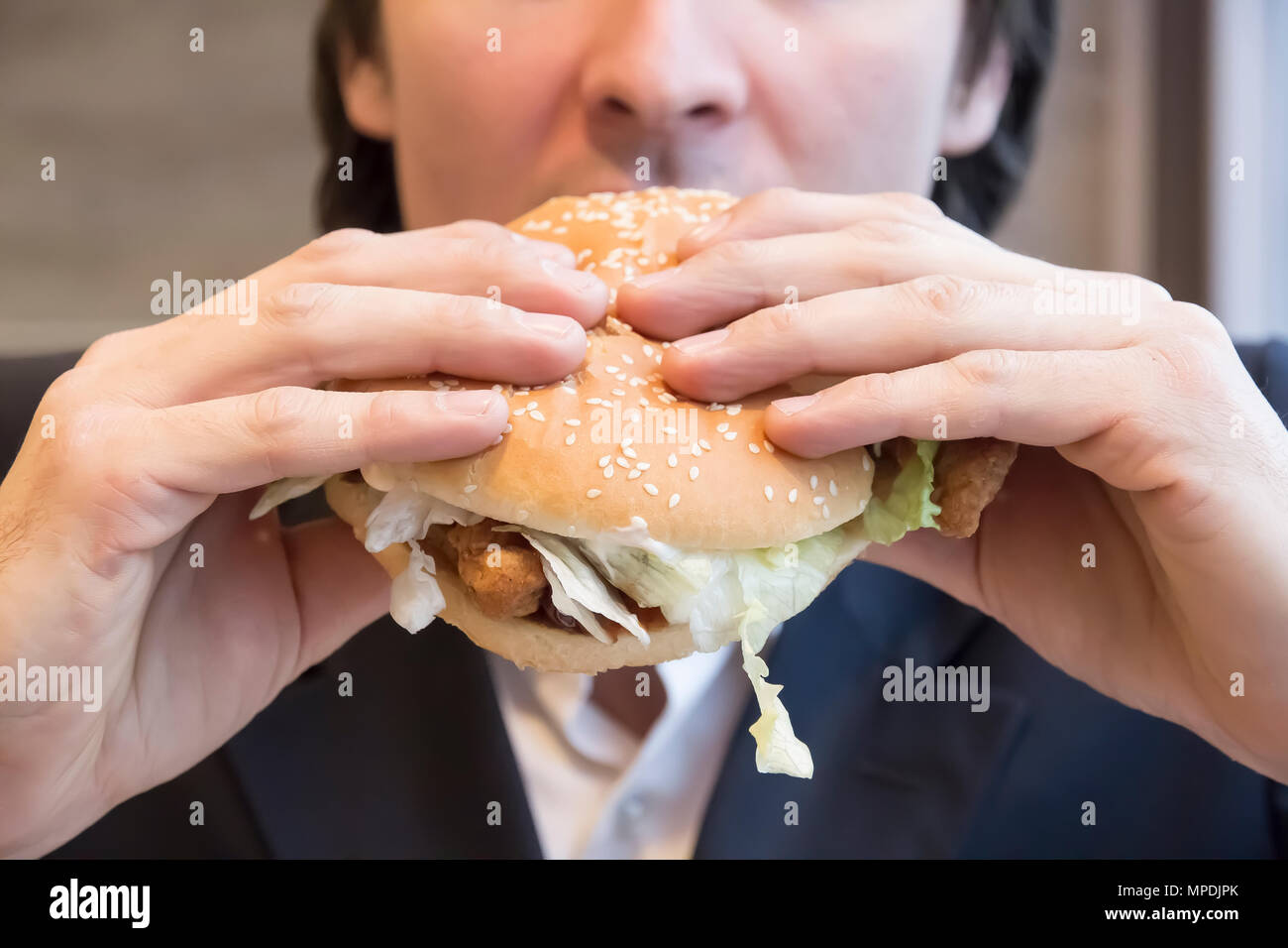 Close up man eating hamburger hi-res stock photography and images - Alamy