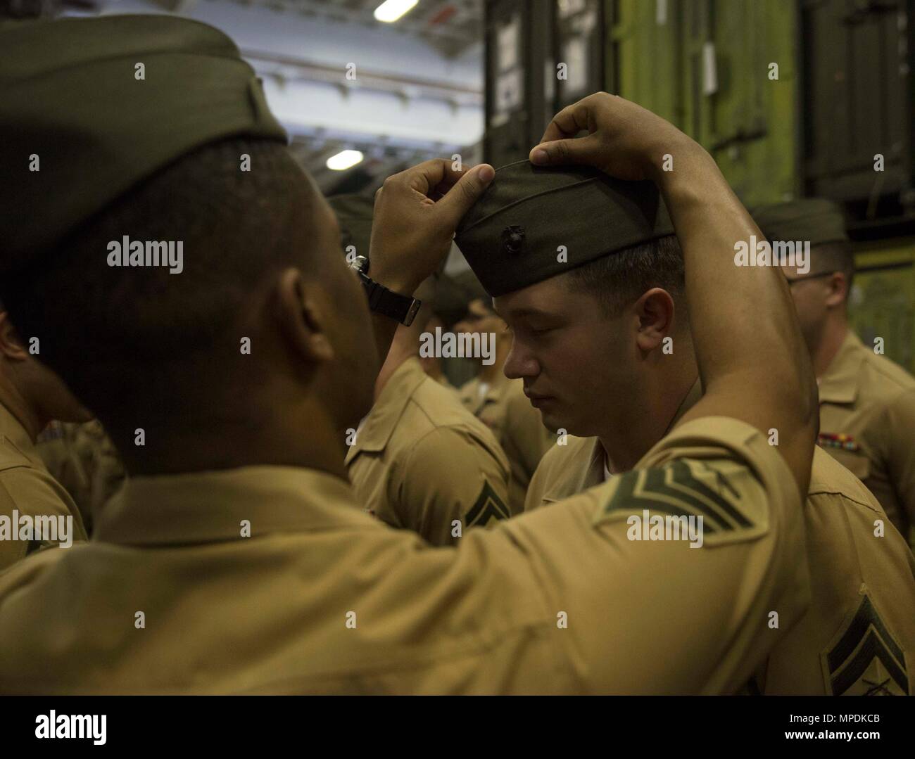 Marines with 3rd Battalion 6th Marine Regiment hold a service uniform ...