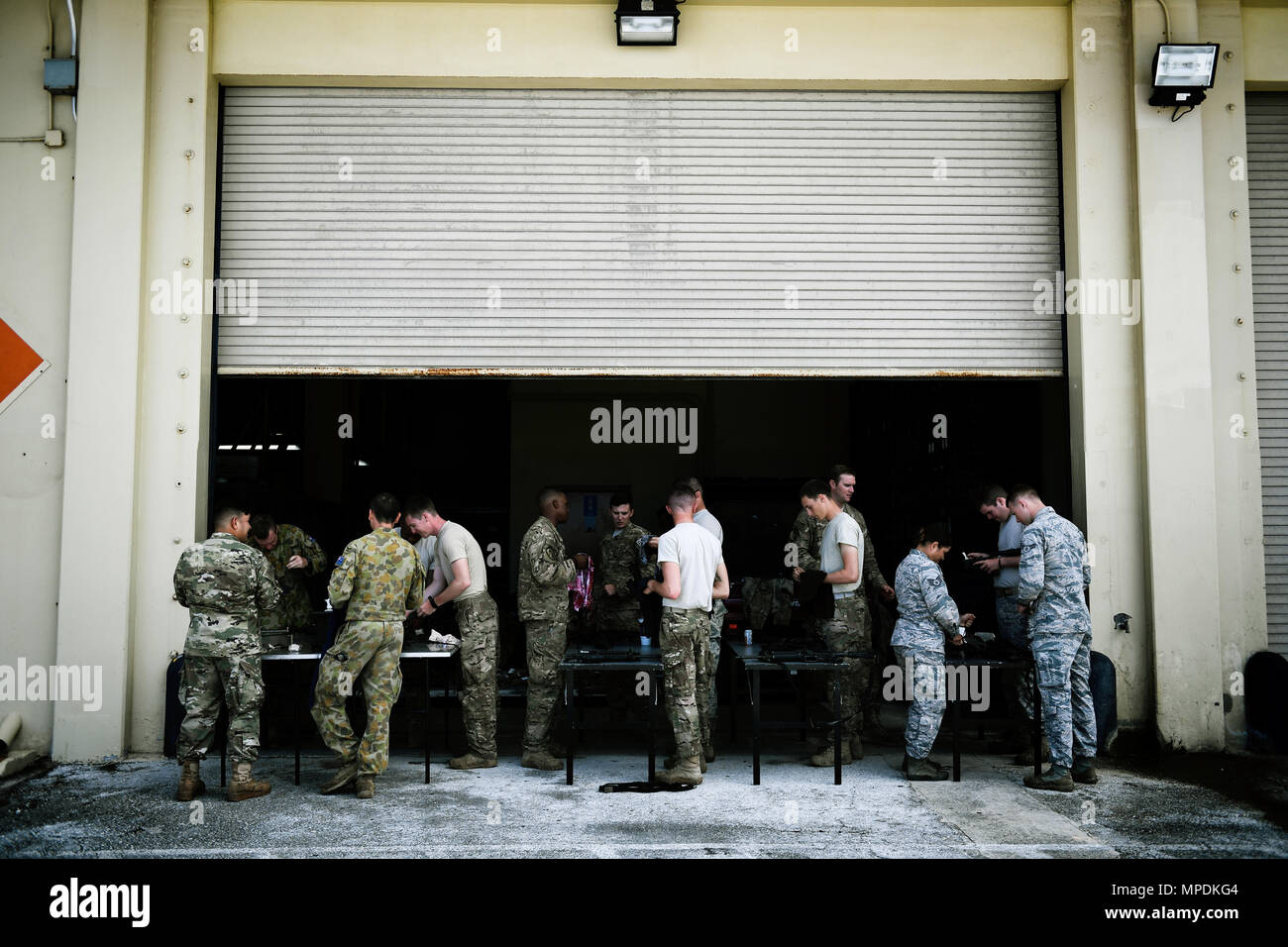 Members from the Royal Australian Air Force No. 1 Security Forces Squadron, U.S. Air Force 824th ...