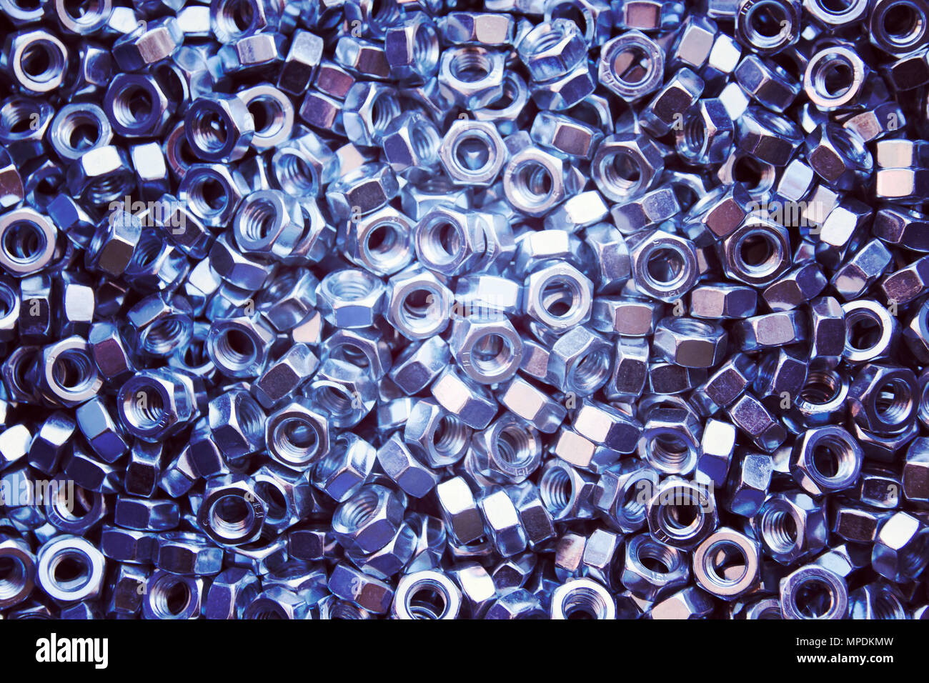 big pile of screw nuts as background Stock Photo - Alamy