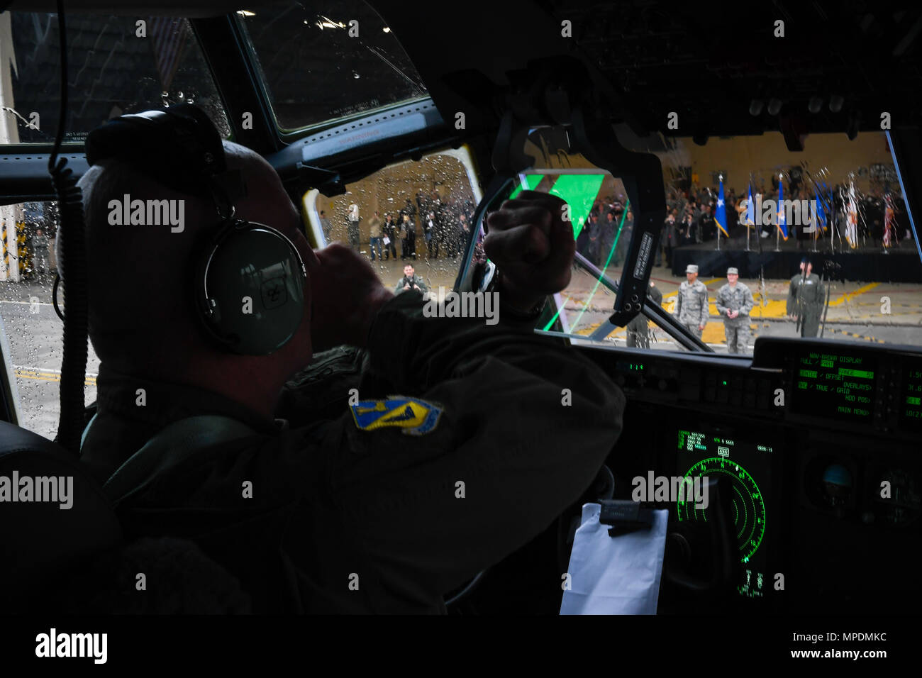 Col. Kenneth Moss, 374th Airlift Wing commander, signals to a crew ...