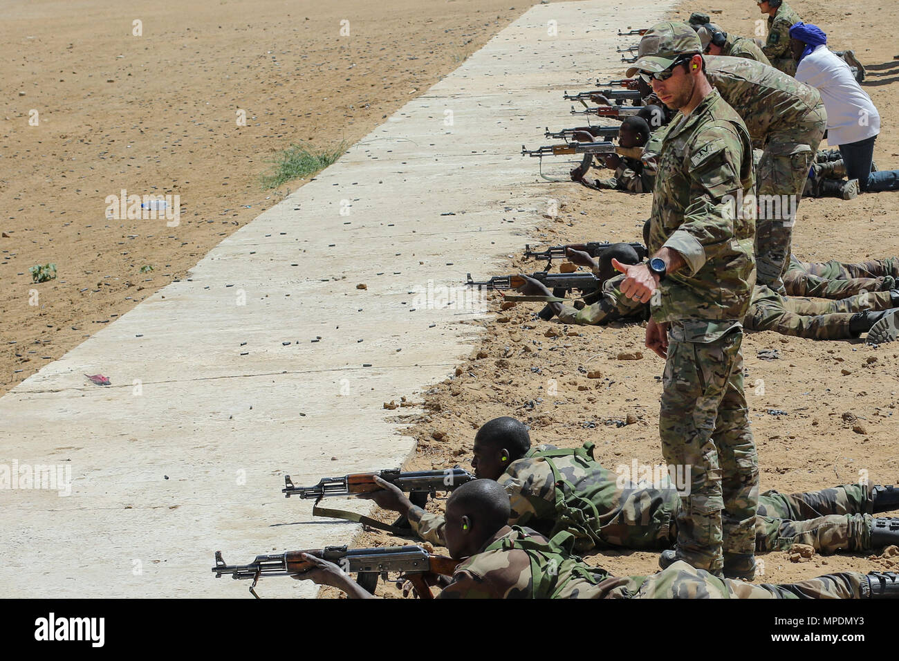 A U.S. Army Special Forces weapons sergeant provides feedback to a ...