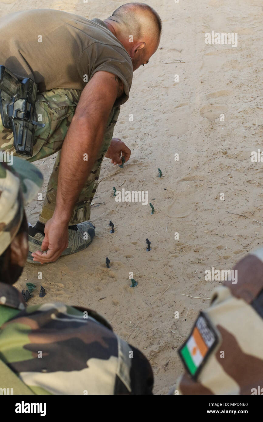 A Belgian Special Operations soldier demonstrates a small unit movement ...