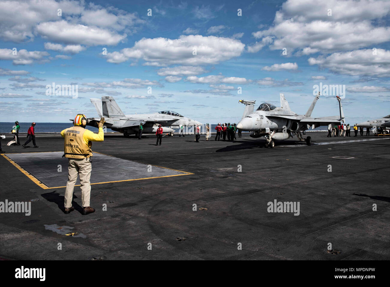 OCEAN (April 10, 2017) Lt. Cmdr. Fernando Byrd, flight deck officer ...