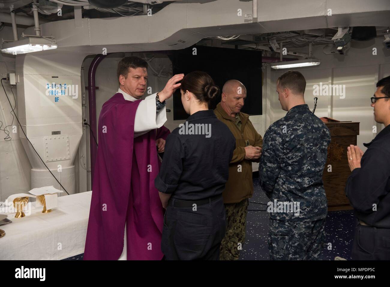 170301-N-KJ380-054 NORFOLK (March 1, 2017) Sailors receive ash on their ...