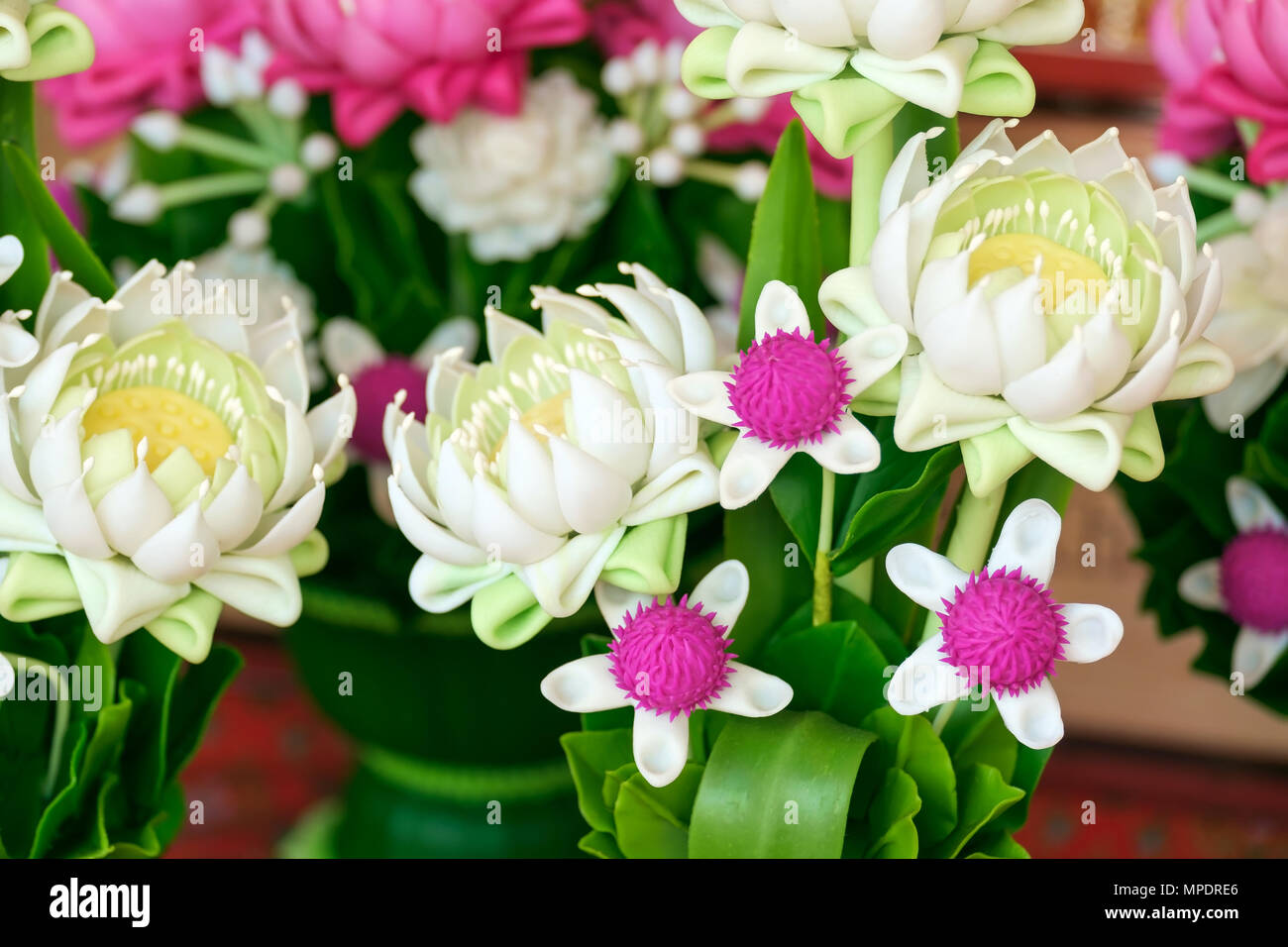 Close up artificial flowers, beautiful decoration flowers lay on the ...