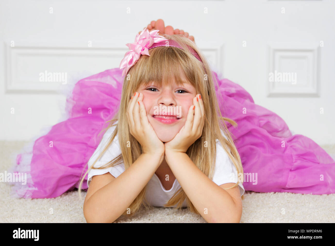 Beautiful girl lying on floor hi-res stock photography and images - Alamy