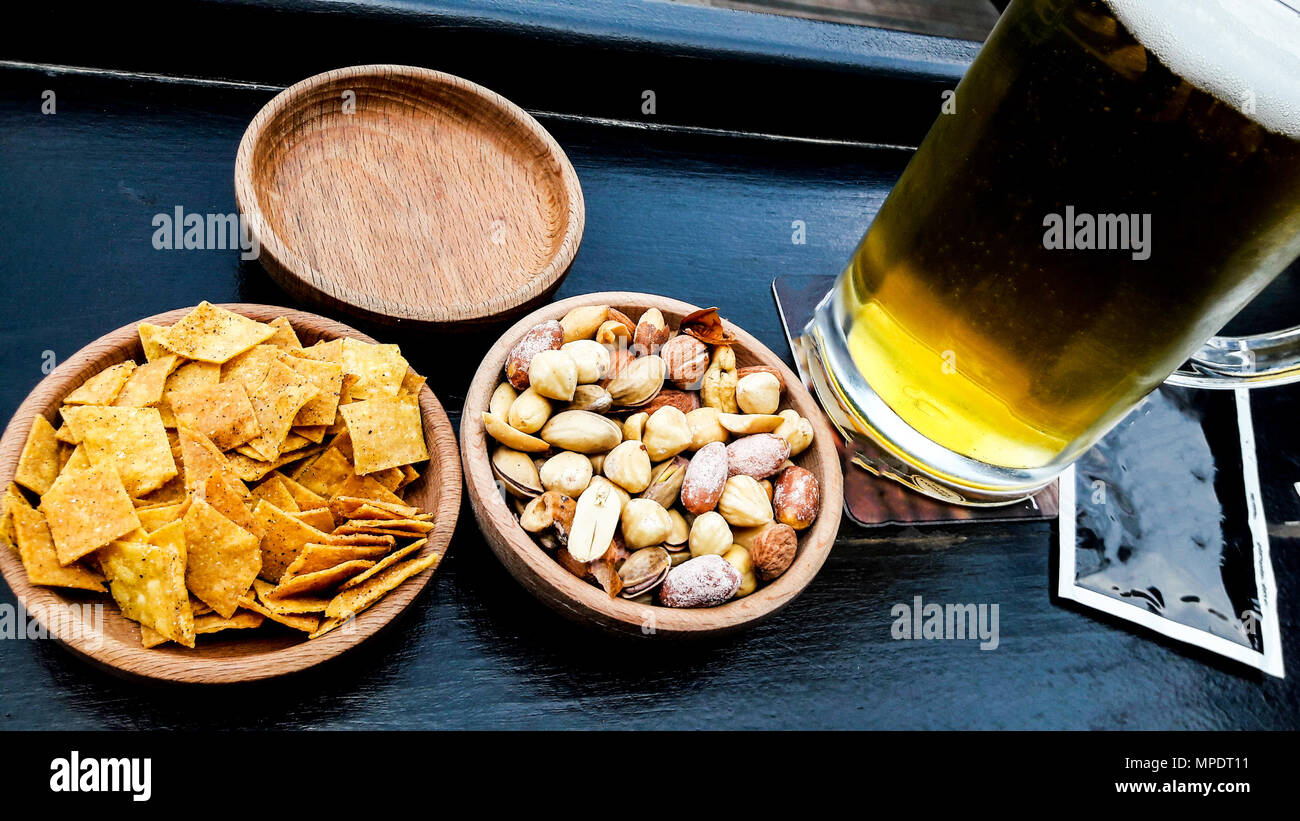Snacks with beer at the bar outside. Fun concept Stock Photo - Alamy