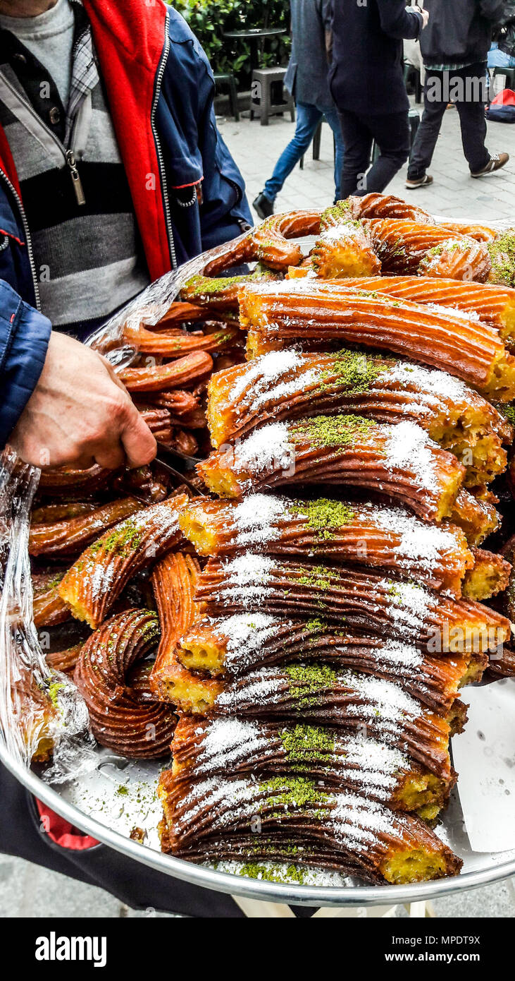 Turkish Street Dessert Kivrim or halka tatlisi with sherbet ...