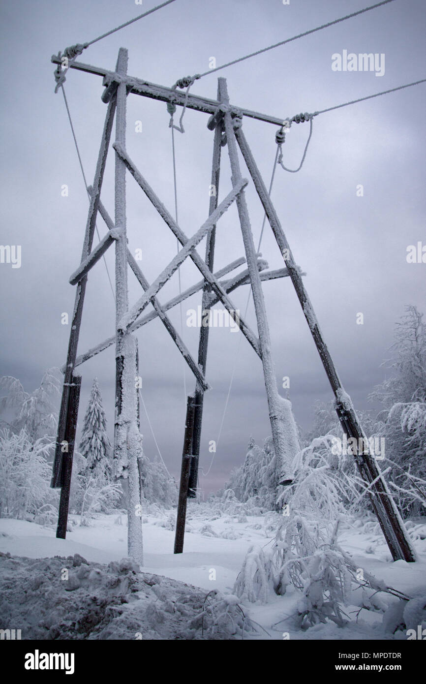 High-tension power line. Snow deposits and slush build-up on high ...