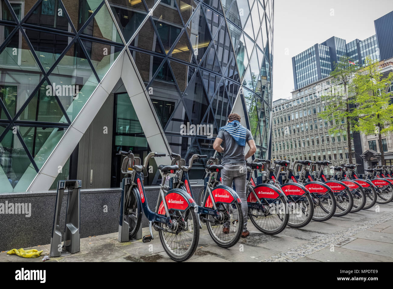 Man Collecting Cycle Outside Gherkin Building Stock Photo - Alamy