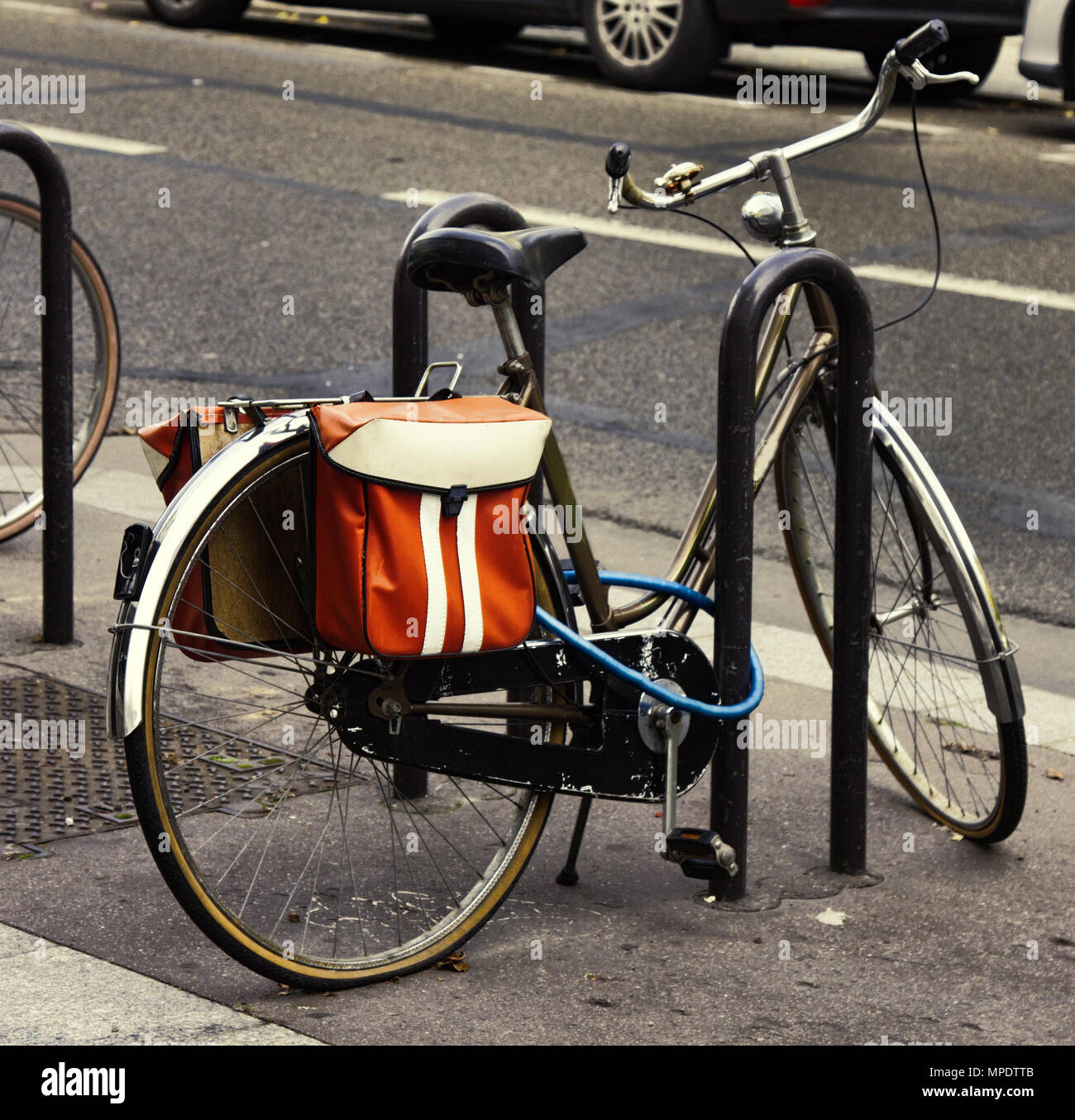 bike is fastened to rack of street fence, bike racks Stock Photo - Alamy