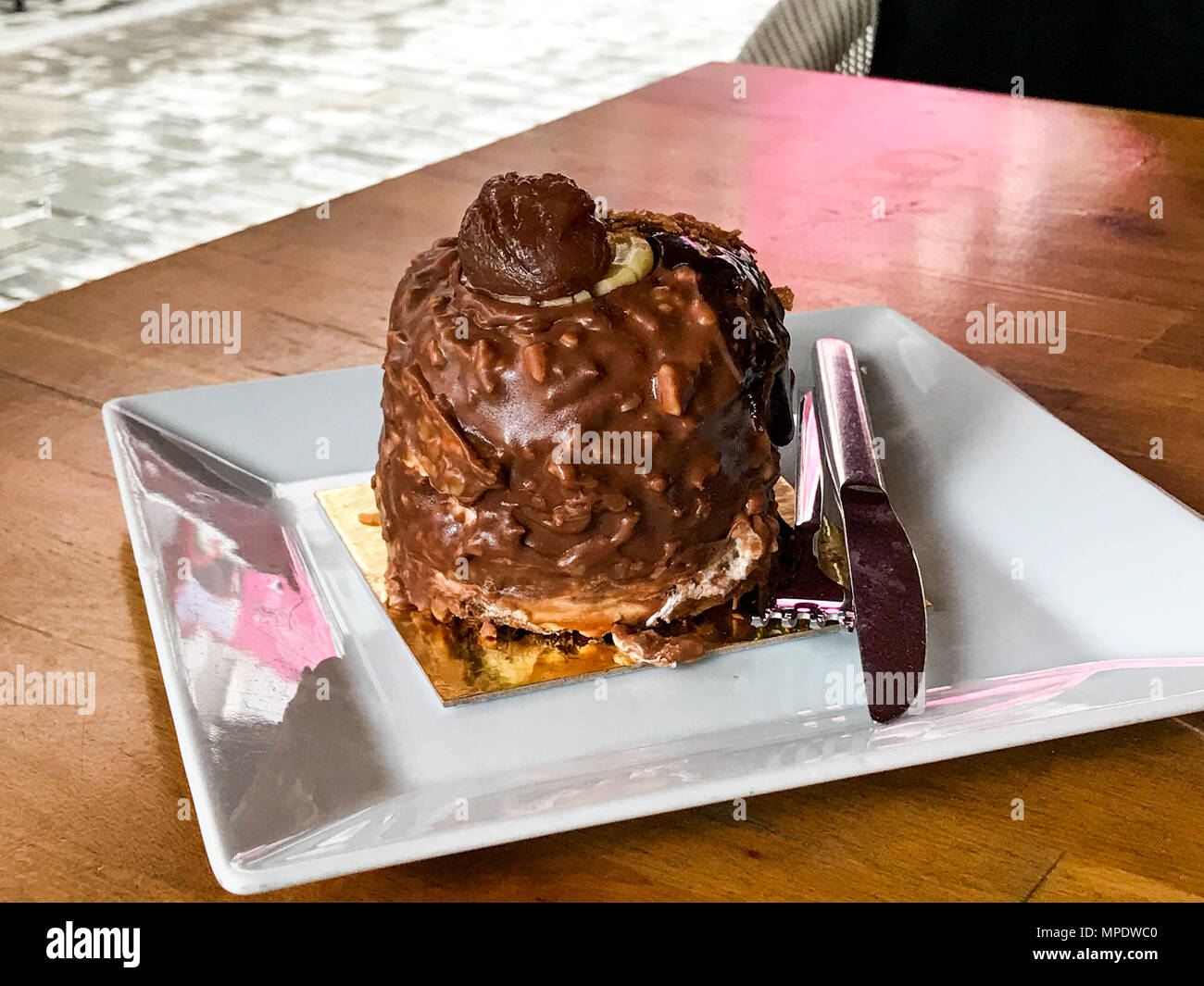 Mini Chestnut Cake with Chocolate Sauce served at Restaurant. Dessert ...