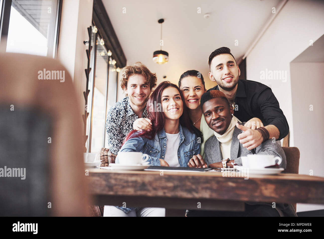 Diverse group people sitting couch hi-res stock photography and images ...
