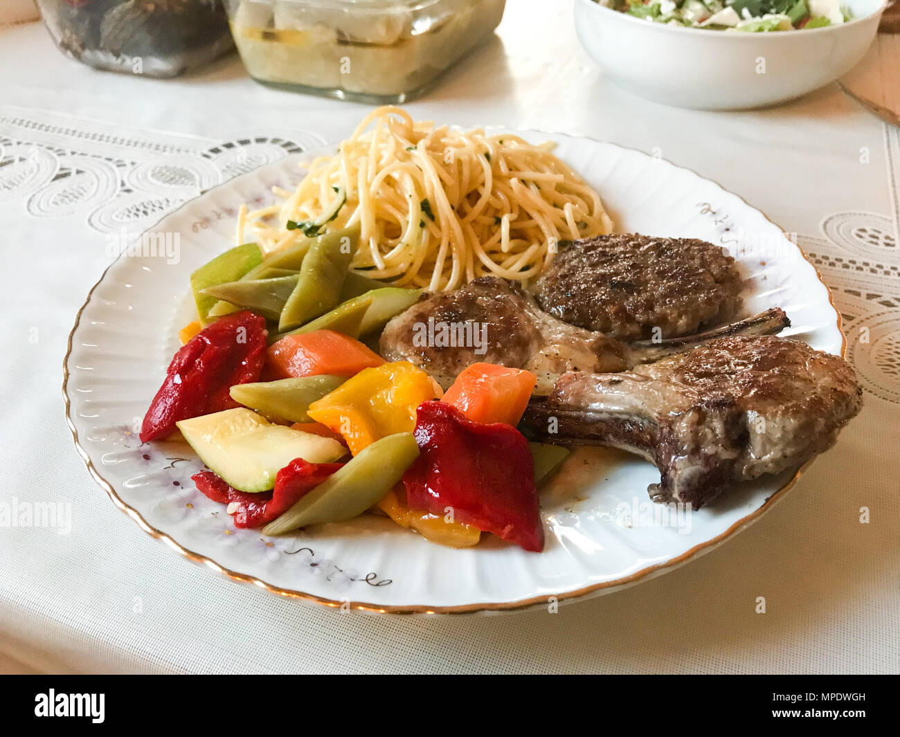 Homemade Food Plate with Lamb Chop, Spaghetti and Vegetables. Organic ...