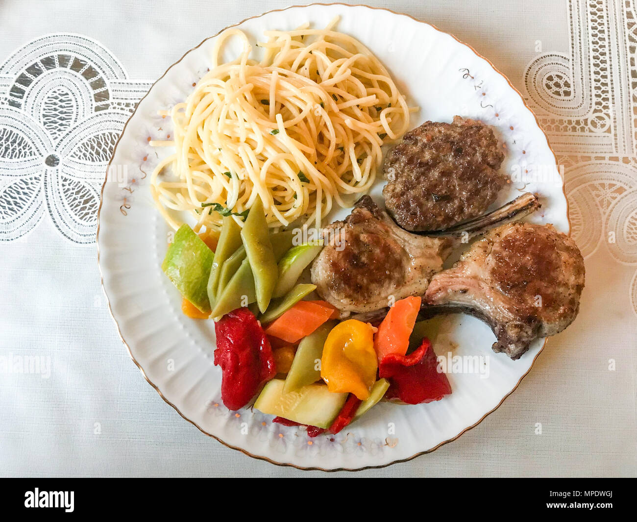Homemade Food Plate with Lamb Chop, Spaghetti and Vegetables. Organic ...