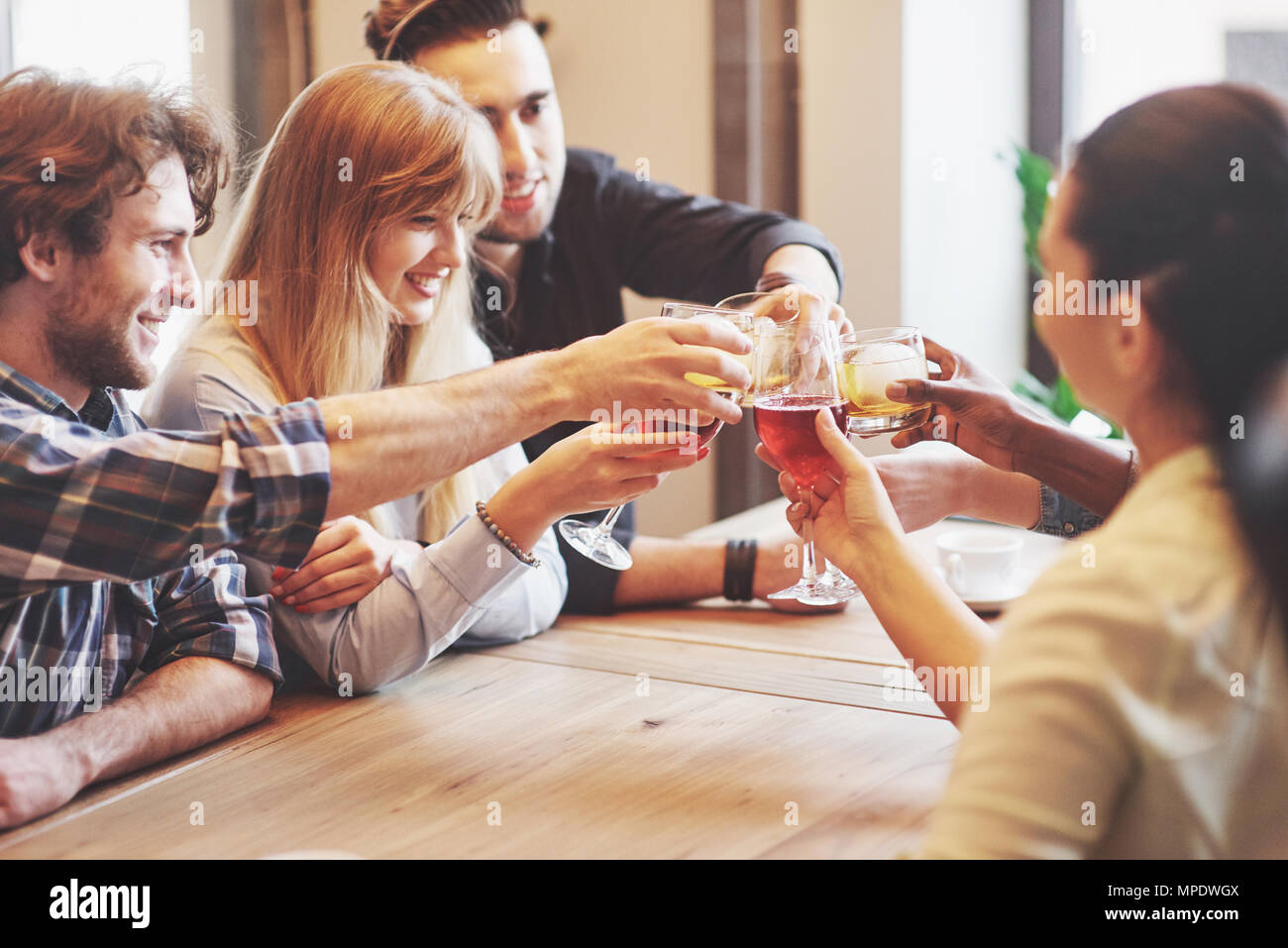 Hands of people with glasses of whiskey or wine, celebrating and ...