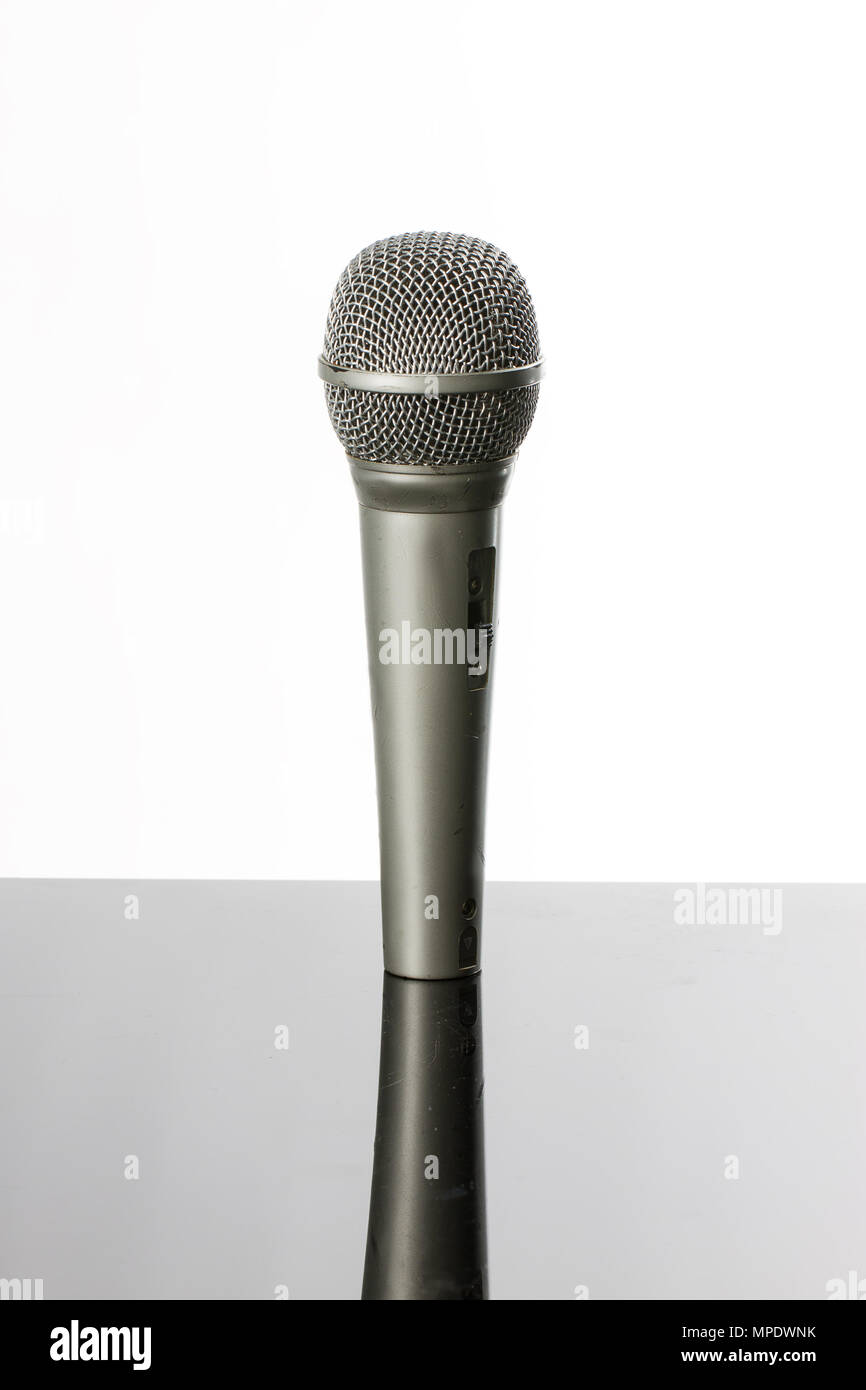 Microphone on a white background with reflection Stock Photo - Alamy