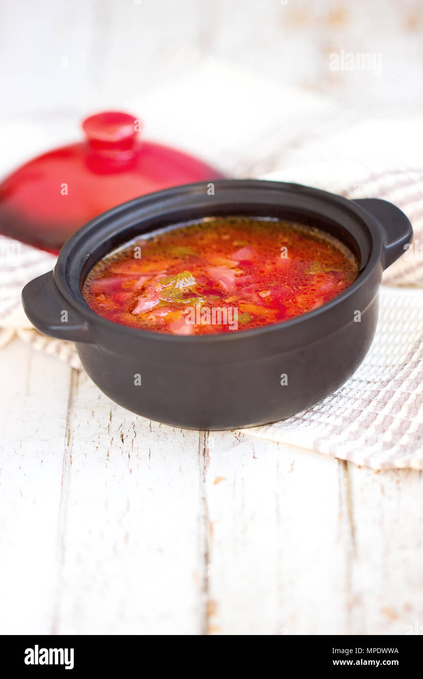 Red borsch. The traditional Ukrainian dish. In a small saucepan. On the ...