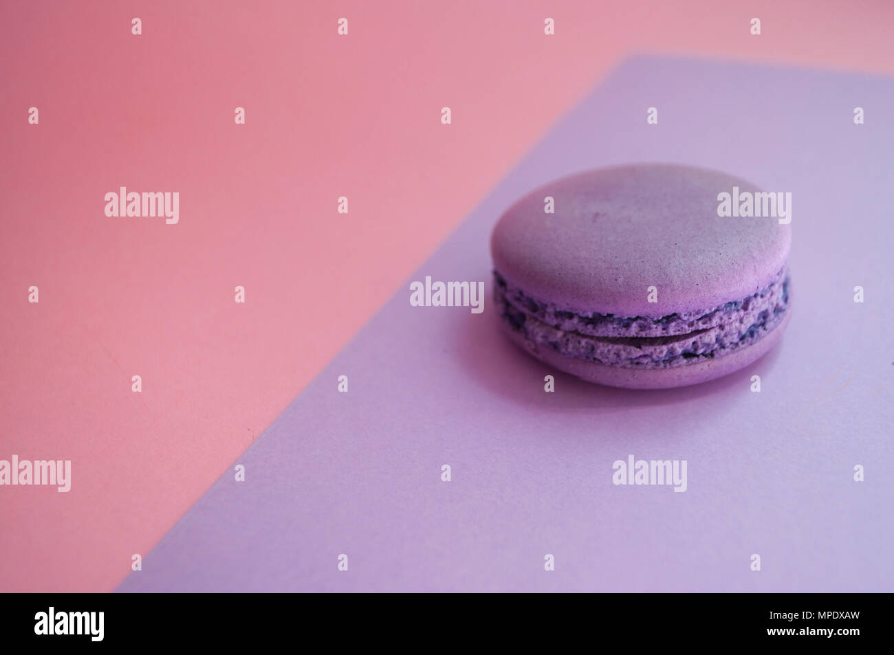 Ultra violet color macaroon on violetand pink background with text ...