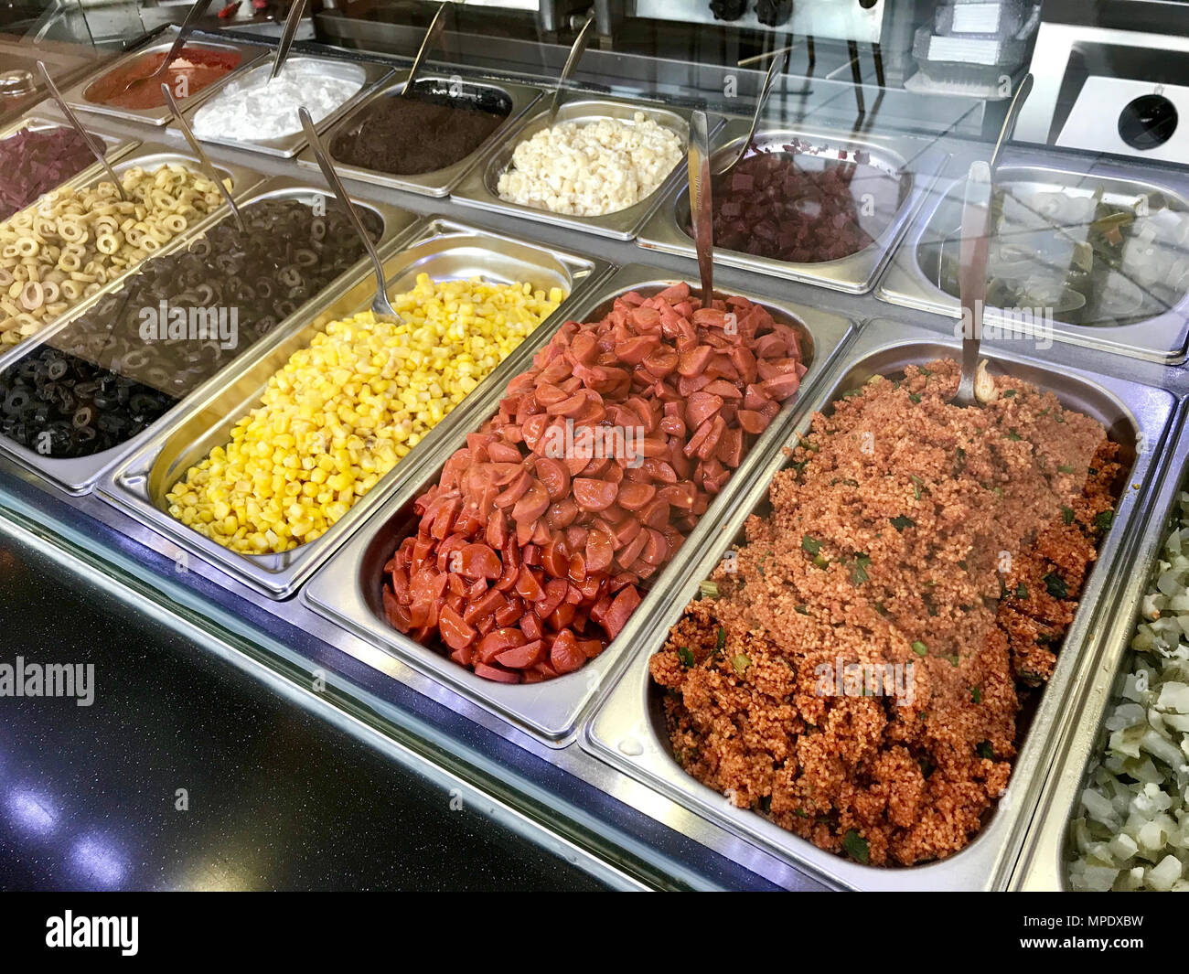 Turkish Kumpir Shop. Baked Potato Stuffed with Bulgur, Sausage, Corn ...