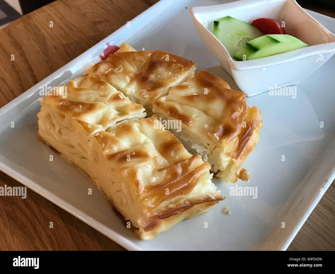 Su Boregi / Turkish Pastry Borek with tomatoes and cucumber served at ...