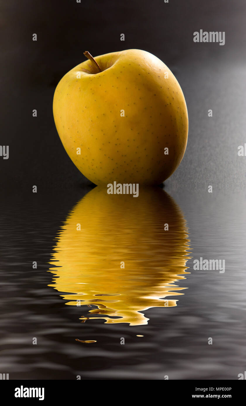 golden apple with reflected Stock Photo - Alamy