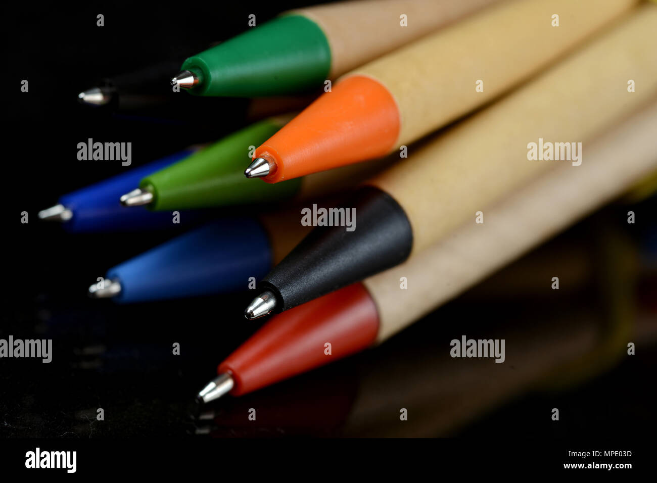 set of paper ballpoint pen on a black background Stock Photo - Alamy