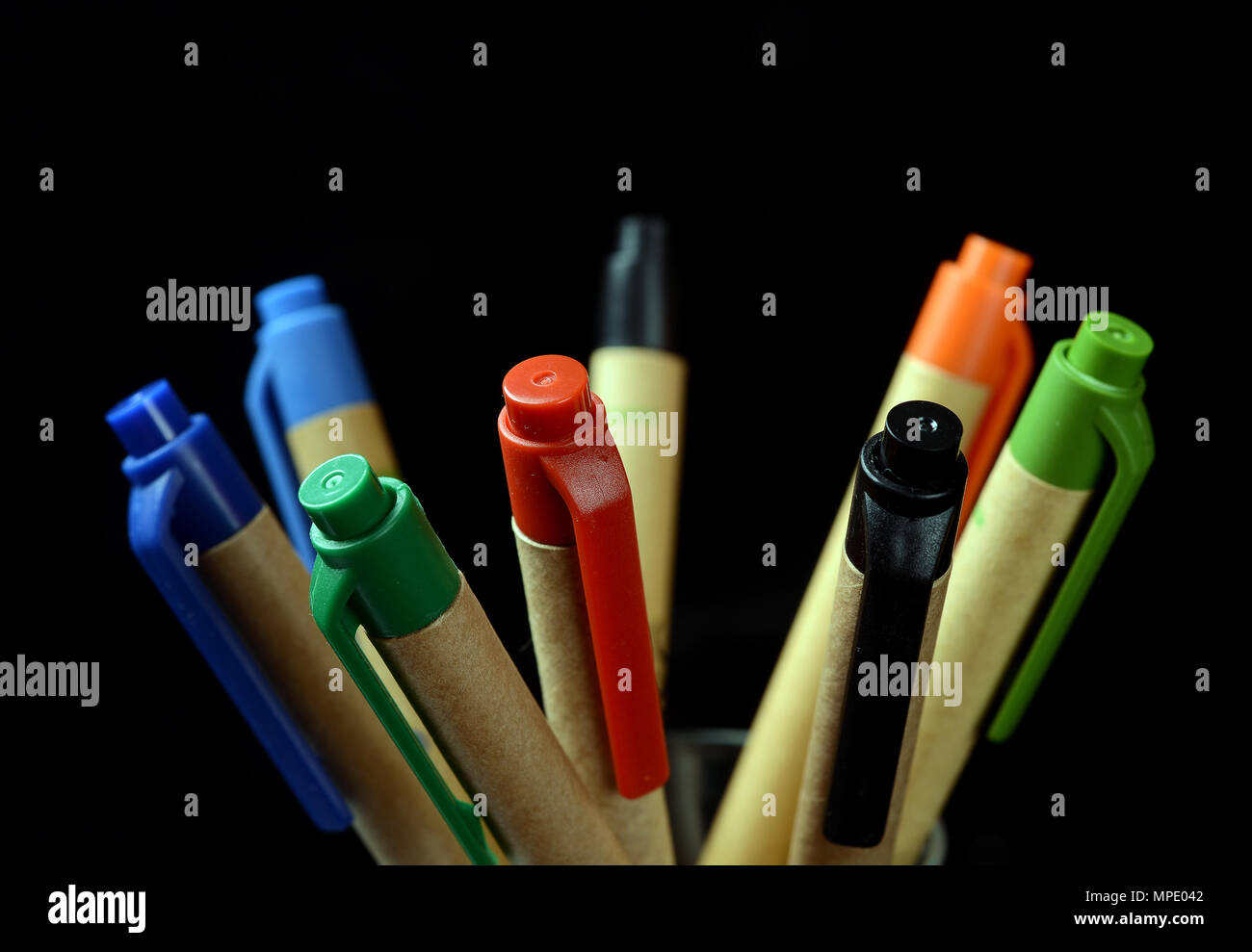 set of paper ballpoint pen on a black background Stock Photo - Alamy